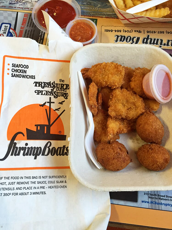 These golden-fried treasures make a compelling case that heaven might just be a Styrofoam container filled with perfectly cooked seafood.