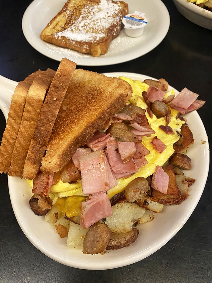 This isn't just breakfast&mdash;it's architecture. Toast buttresses, ham foundation, eggs as the centerpiece, with potatoes providing the essential structural support.