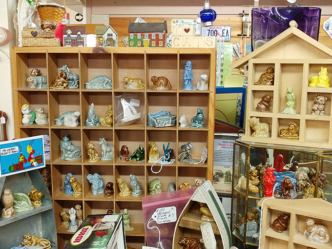 Miniature menageries fill wooden cubbies like a Noah's Ark of ceramic creatures. Each tiny figurine tells a story bigger than its diminutive size.