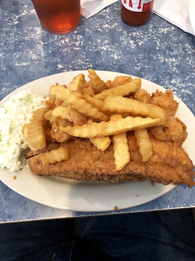 The fish so perfectly fried it makes you wonder if there's a Ph.D. in breading somewhere in the kitchen. Crispy, flaky, and utterly sublime.