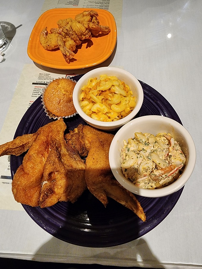 The holy trinity of Southern comfort: golden chicken, creamy mac and cheese, and a side that proves coleslaw deserves more respect.