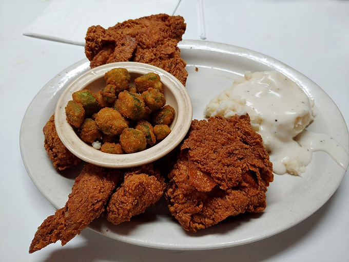 Fried chicken that makes you understand why people write songs about Southern cooking, served with okra that's been properly introduced to cornmeal.