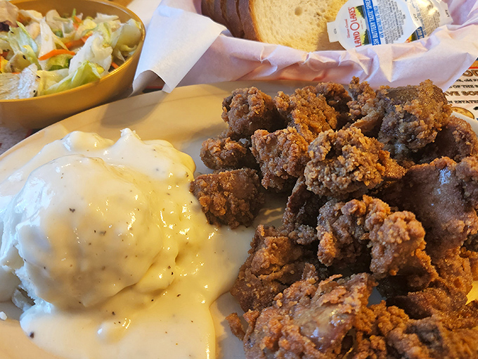 Adventurous eaters know the secret: those velvety mashed potatoes swimming in gravy alongside crispy gizzards are worth the drive alone.
