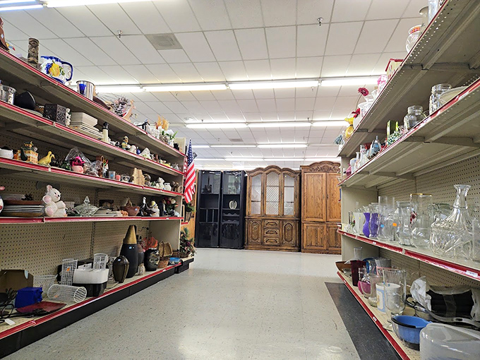 An aisle of glassware and knickknacks creates a museum of domestic history. Every shelf holds potential housewarming gifts or conversation pieces for your next dinner party.