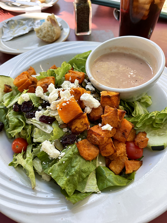 A salad that actually satisfies! Those roasted sweet potato cubes add a pop of color and flavor that would make even salad skeptics reconsider.