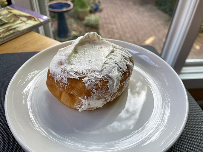 The cream-filled masterpiece that makes you reconsider what a donut can be. Pillowy soft with just enough resistance before surrendering to that sweet filling.
