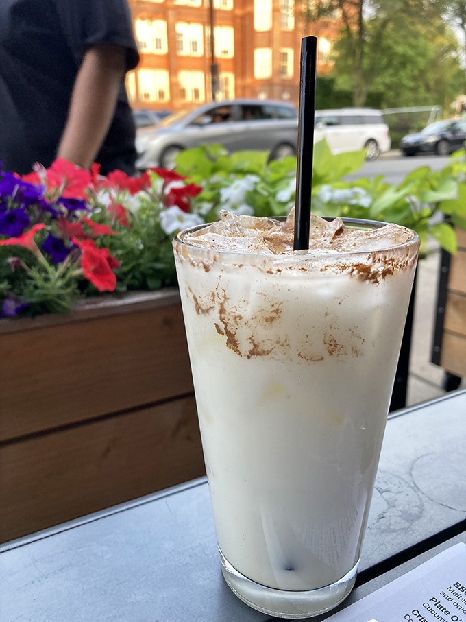 This isn't just a milkshake&mdash;it's a creamy revelation in a glass, garnished with possibility and window-side flowers.