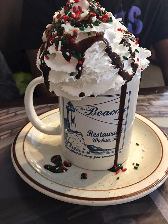 Hot chocolate that's more dessert than drink, crowned with whipped cream, chocolate drizzle, and festive sprinkles&mdash;winter in a mug.