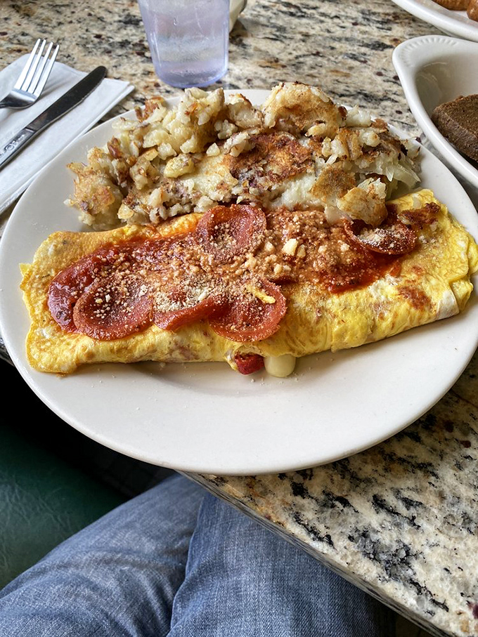 An omelet that's having an identity crisis in the best possible way. Pizza flavors crashed breakfast, and nobody's complaining about the delicious merger. 