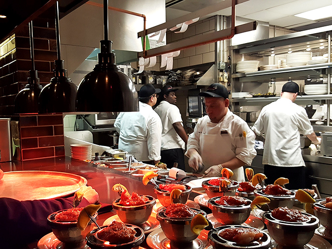 Behind the scenes magic: The kitchen crew prepares those famous shrimp cocktails with their sinus-clearing horseradish sauce. Tissues not included.