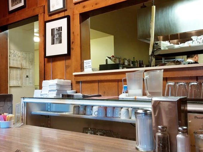 The kitchen pass&mdash;where culinary magic transitions from chef's hands to hungry guests. Simple, efficient, and unchanged for generations.