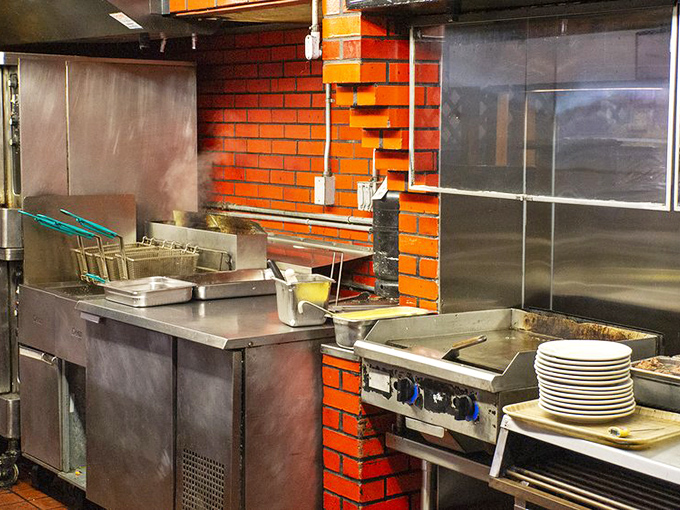 Behind the scenes, where culinary magic happens on stainless steel and brick&mdash;the engine room of satisfaction.