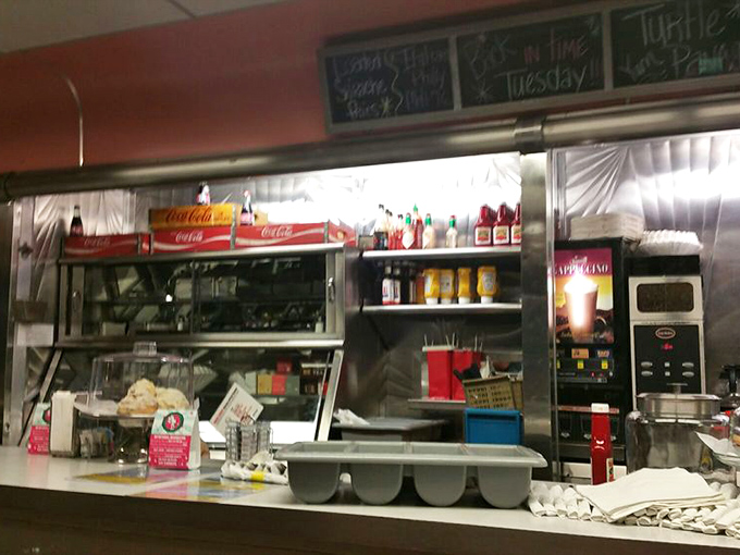 Behind the counter, the organized chaos of a diner kitchen&mdash;where magic happens on griddles and short-order cooks perform their daily ballet.