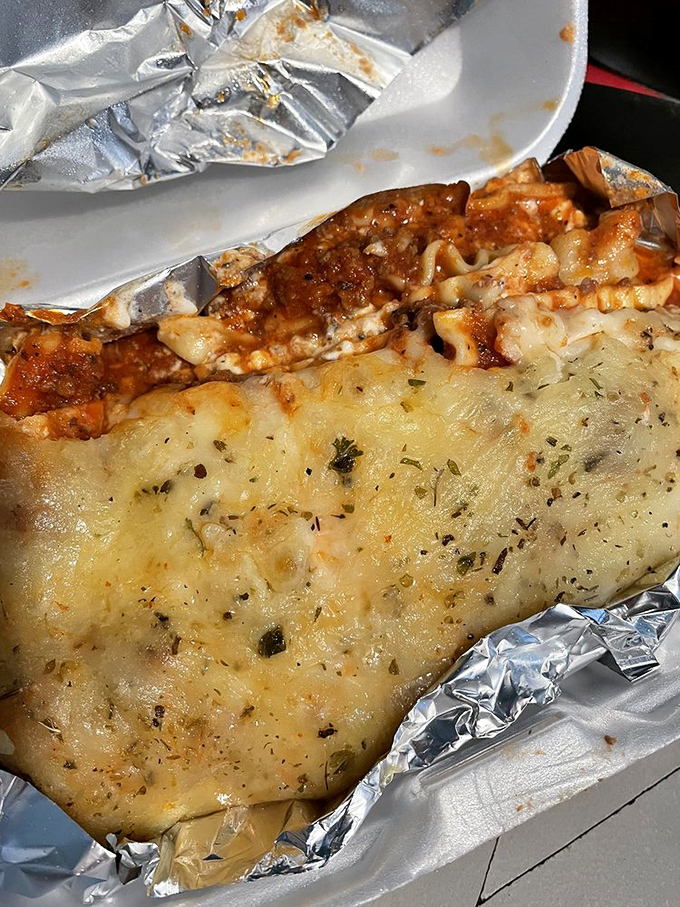 This isn't just lasagna—it's layers of comfort wrapped in cheese and sealed with garlic bread. Therapy you can eat.