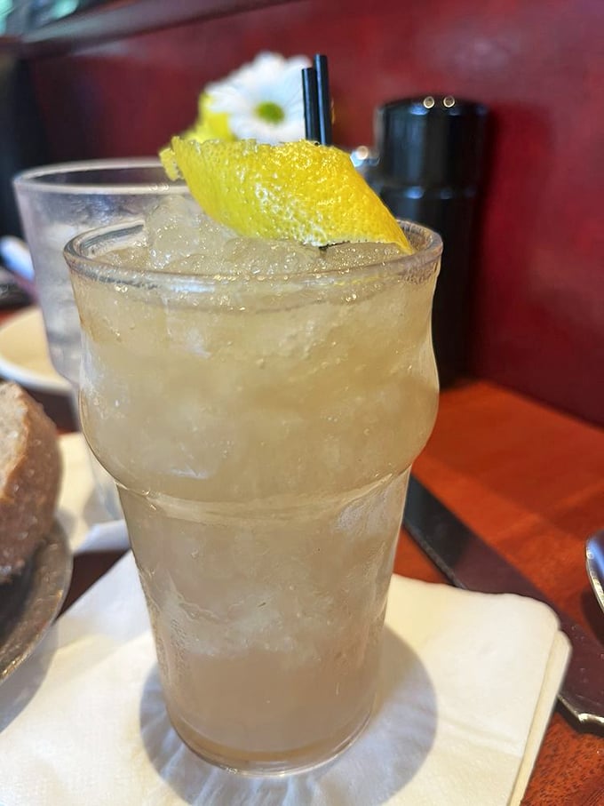 The Lavender Smash cocktail, garnished with lemon, brings garden freshness to happy hour. Like summer afternoon in a glass, minus the humidity.