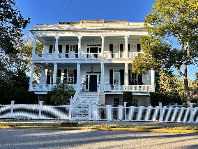 The Lewis Reeve Sams House stands as a testament to antebellum architecture &ndash; all columns, porches, and Southern dignity behind that perfect white picket fence.