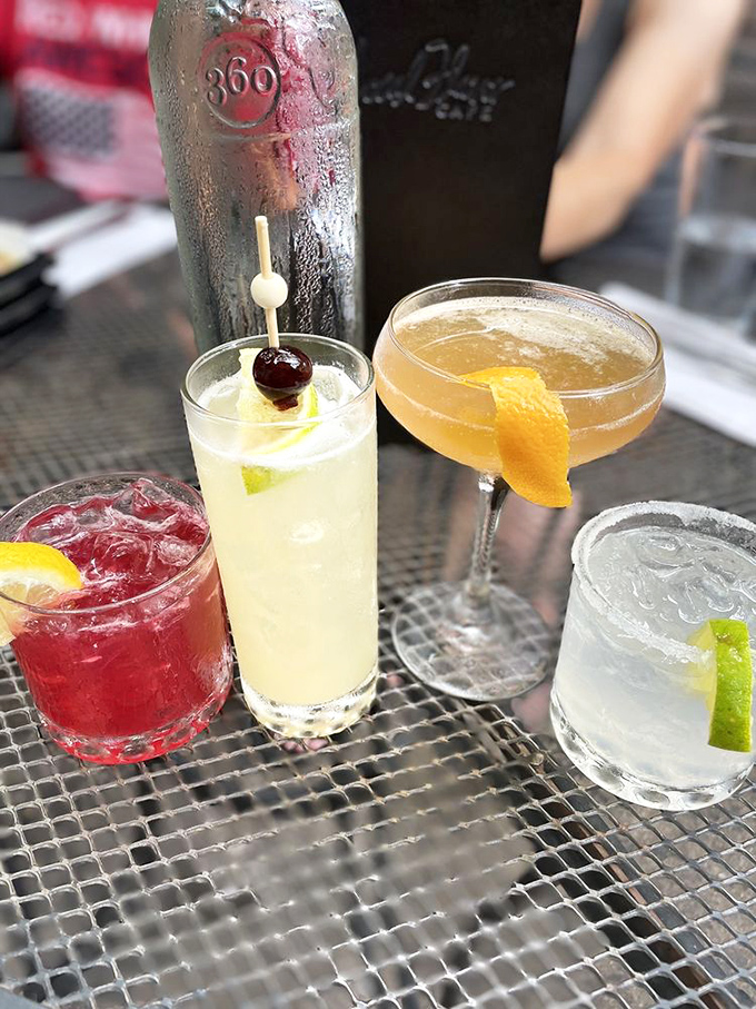 Cocktails at Local Flavor Café arrive like liquid jewels – ruby red, amber gold, and crystal clear concoctions that promise celebration in every sip.