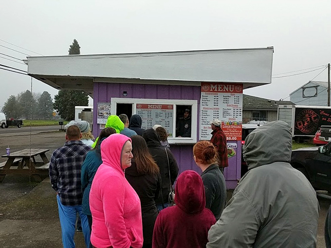 Rain or shine, the line forms. These barbecue pilgrims know that good things come to those who wait.