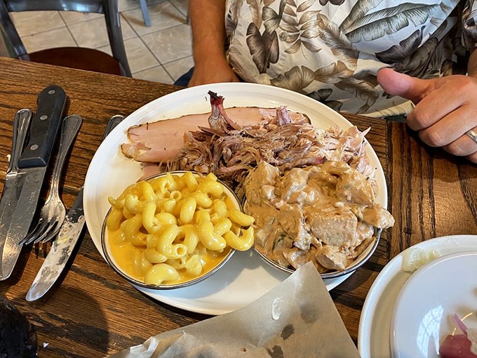 Mac and cheese that achieves that perfect balance of creamy and sharp, sitting alongside pulled pork like they've been best friends since childhood.