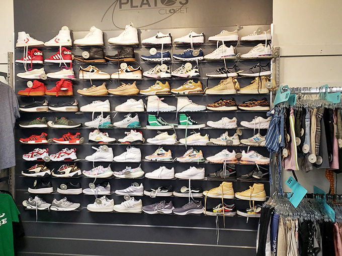 The wall of men's sneakers resembles an art installation, with each pair promising miles of style for a fraction of retail price.