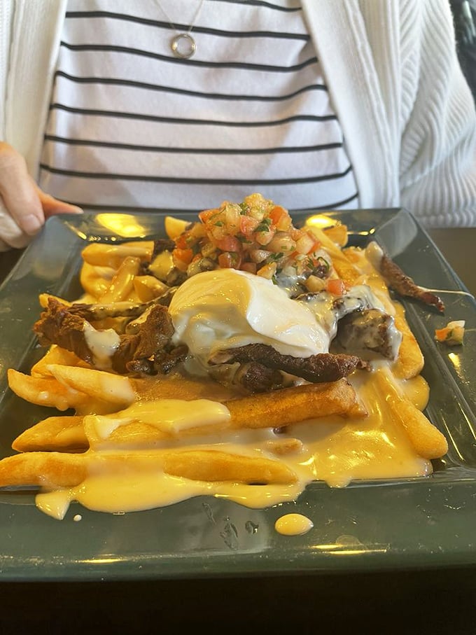 A quesadilla posing with its entourage of guacamole and pico de gallo. This trio performs better together than most rock bands.