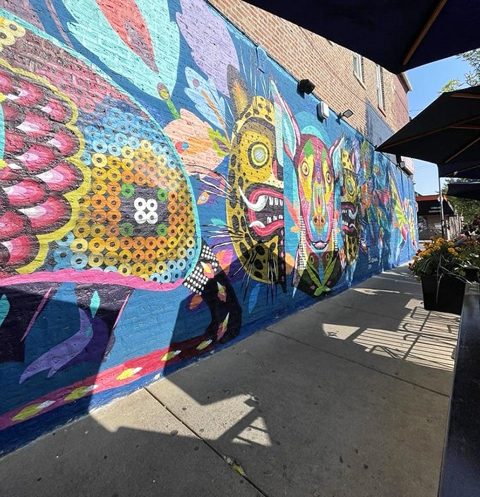 The exterior mural isn't just decoration&mdash;it's a psychedelic preview of the flavor explosion waiting inside, painted in colors as bold as the food.