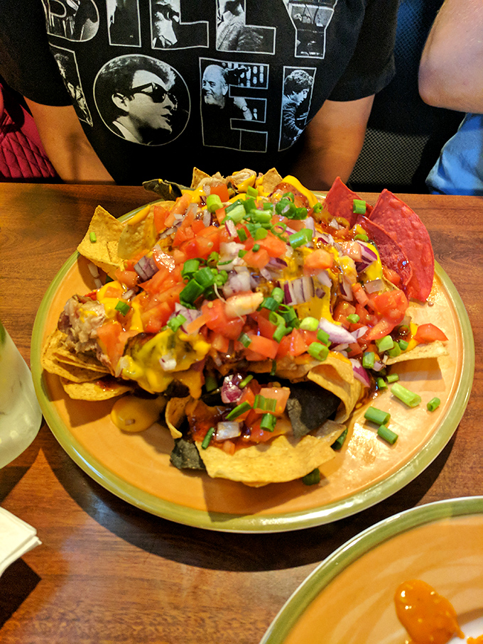 Nachos that require a strategy to eat&mdash;each chip a delivery system for that colorful mountain of toppings and melty cheese.
