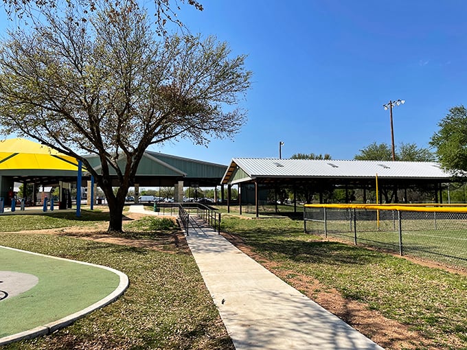 Old Fair Park provides shaded pavilions and walking paths for community gatherings. Where memories are made and family reunions survive the Texas heat.