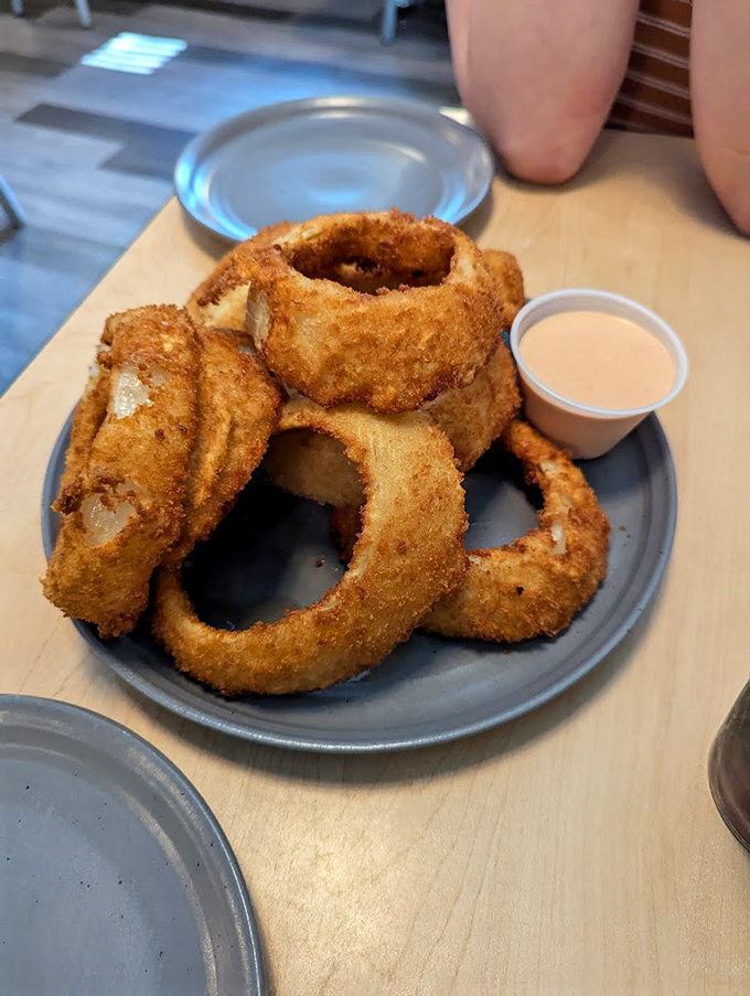 These aren't just onion rings; they're golden halos of crispy perfection that make you question why you ever settled for fries.