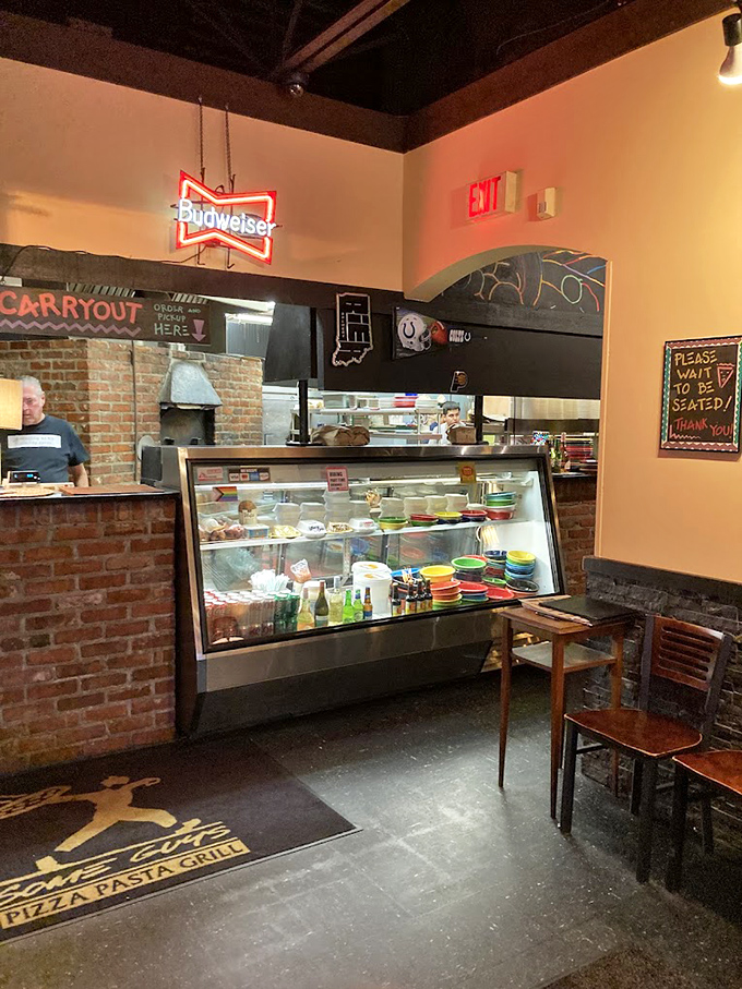 Where pizza dreams begin. The counter's "Please Wait to be Seated" sign might as well read "Patience Will Be Rewarded."
