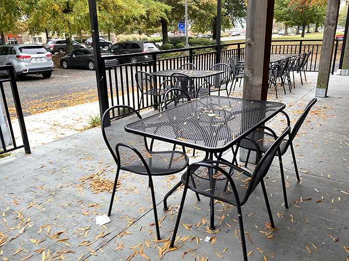Fall leaves scatter around outdoor tables that await the brave souls who can't bear to put walls between themselves and their BBQ experience.