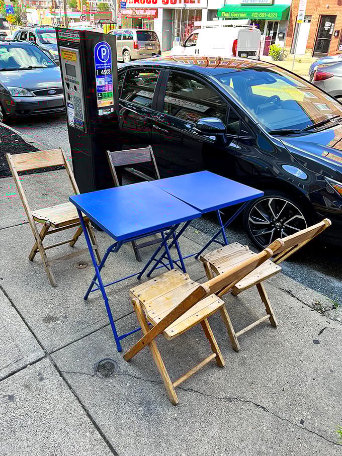 Sidewalk seating that says "life's too short to eat indoors when there's people-watching and tacos to be enjoyed simultaneously."