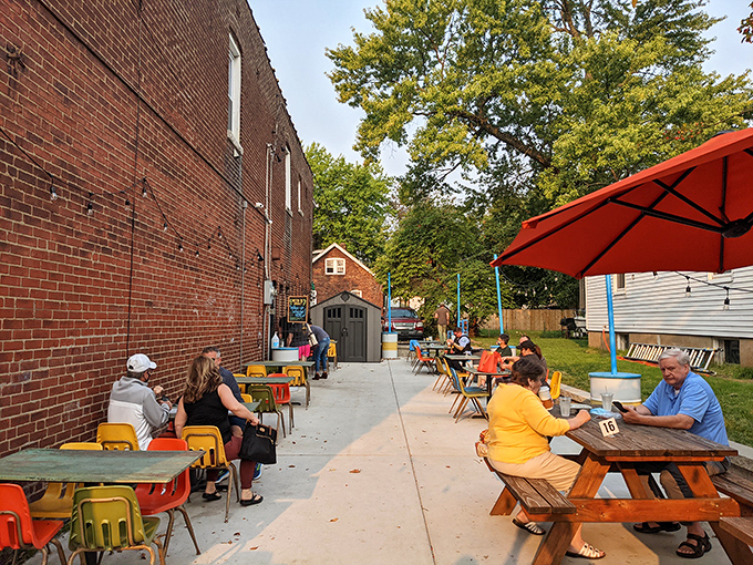 Outdoor tables painted in sunshine colors make even waiting for a table feel like part of the experience rather than a delay.
