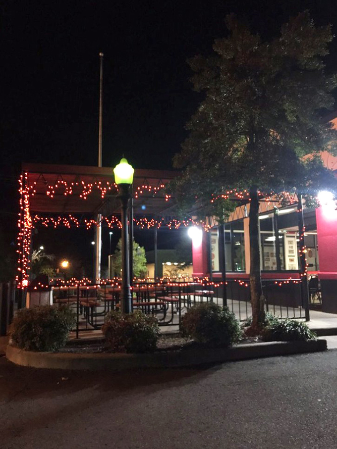 As night falls, the outdoor seating area transforms into a twinkling oasis, where fried pie enjoyment continues under the stars.