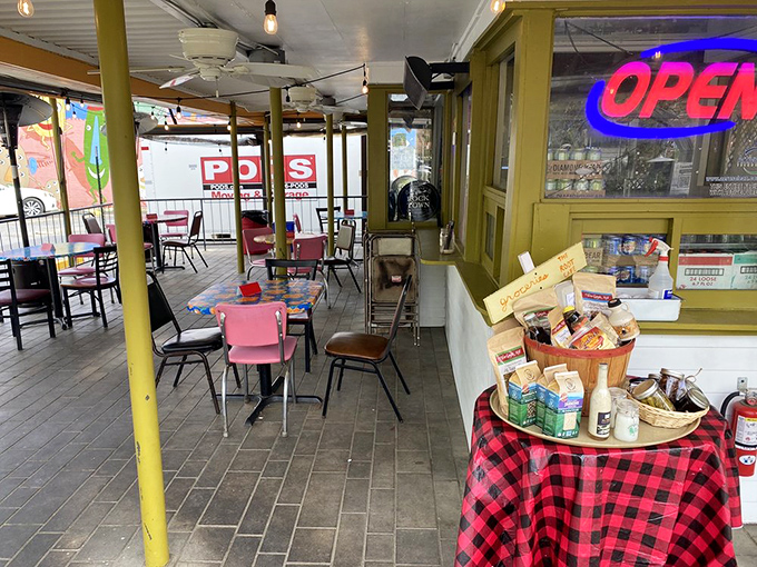 The outdoor seating area &ndash; where fresh air enhances flavor and checkered tablecloths remind you that simple pleasures are often the best.