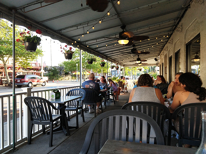 The covered patio offers prime people-watching with your pint&mdash;strung lights overhead turning ordinary evenings into something a bit magical.