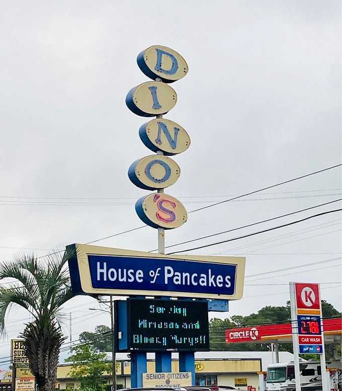 The vertical DINO'S sign stands tall against the Carolina sky, a retro beacon calling to breakfast pilgrims from miles around.