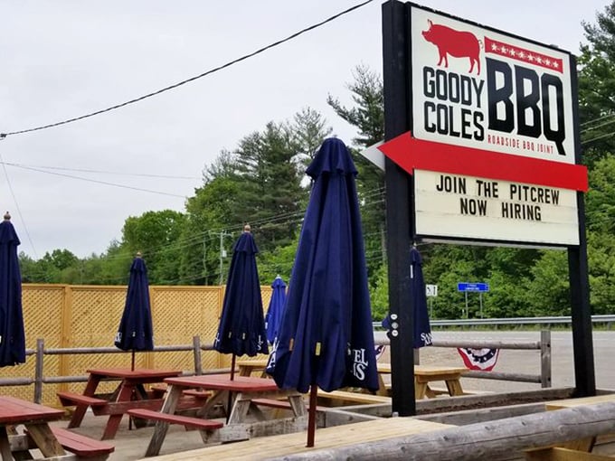 Outdoor picnic tables stand ready for warmer days, while the sign makes it clear&mdash;this isn't just a restaurant, it's a joining of the barbecue faithful.