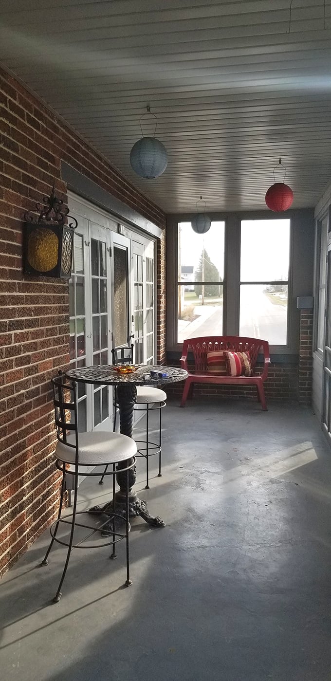 The entryway's simple charm serves as a decompression chamber between the outside world and the beef-scented paradise that awaits within.