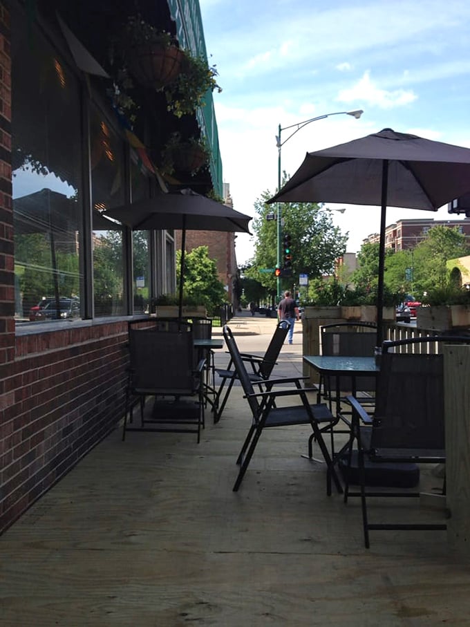 Summer in Chicago means sidewalk seating under those green umbrellas &ndash; turning breakfast into an urban picnic with city soundtrack included.