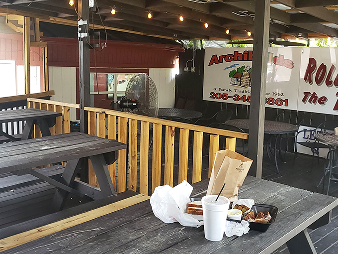 Al fresco dining, Archibald's style. Even the picnic tables look ready for a serious meat meeting under that rustic canopy.