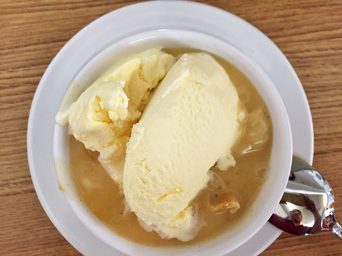 Peach cobbler with ice cream melting into warm fruit&mdash;a dessert so good it should require a permission slip from your doctor.