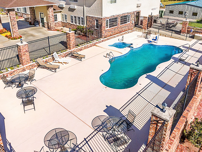 Even small towns need poolside relaxation. This inviting oasis proves you don't need an ocean to enjoy a perfect summer day.