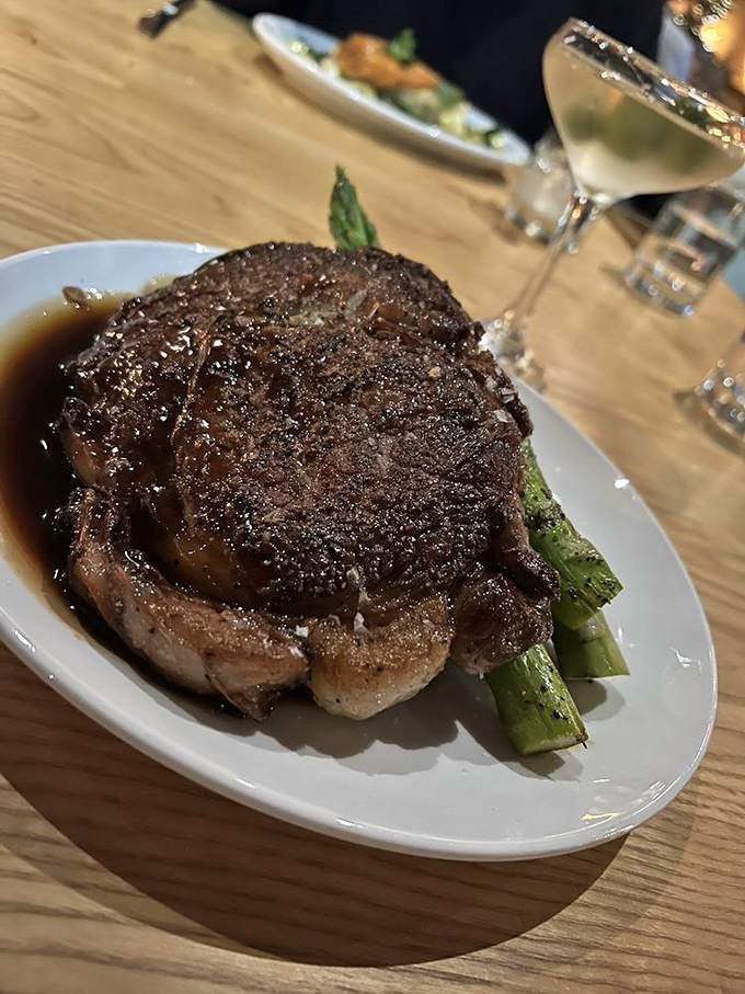 A ribeye so perfectly seared it makes you wonder if the chef has some sort of advanced degree in the physics of meat.