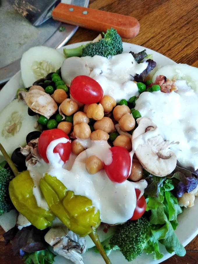 This isn't just a salad; it's a colorful rebellion against the notion that pizza joints can't do vegetables right. Spoiler alert: they can.