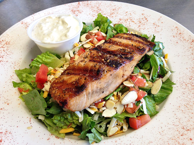 Proof that even salmon gets the royal treatment at Parker's&mdash;wood-fired and perched atop a garden of fresh greens like it's posing for a magazine cover.