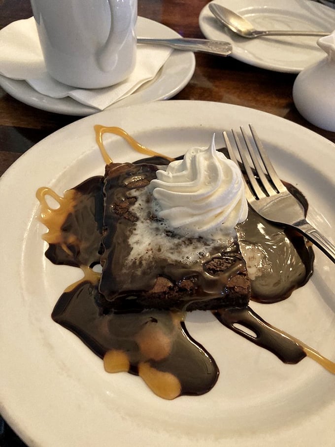 Chocolate brownie swimming in caramel sauce&mdash;dessert's answer to "go big or go home." The whipped cream is just showing off at this point.