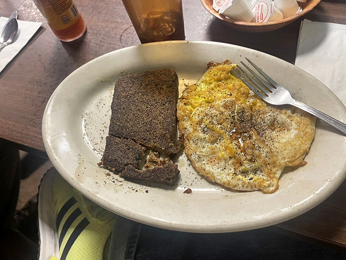 Scrapple and eggs&mdash;a breakfast combination that's sparked more Delaware debates than politics. The crispy edges tell me someone in the kitchen cares.
