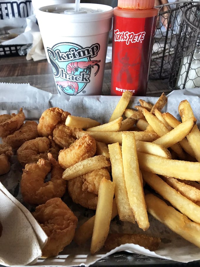 Fried shrimp and fries arranged like edible modern art. If Picasso made lunch instead of paintings, it might look something like this.