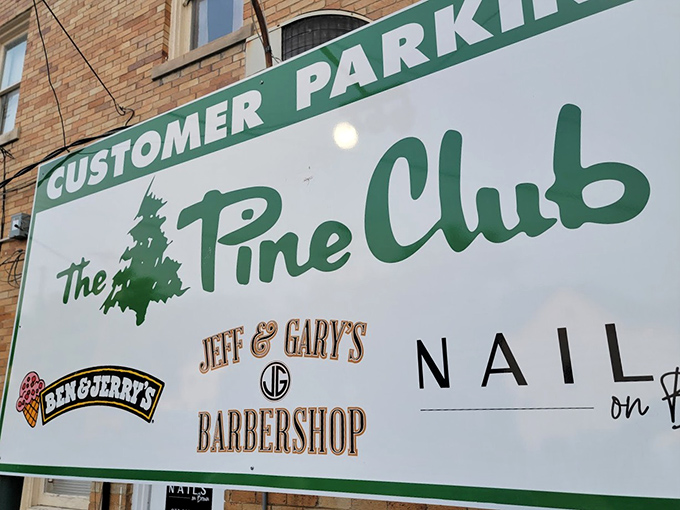 The neighborhood parking sign reveals The Pine Club's place in the community. Even the signage has that classic, no-nonsense charm.